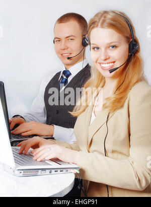 Successful business people talking with receptionist Stock Photo - Alamy
