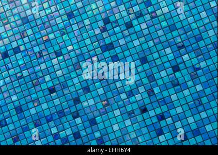 Blue tiles on the bottom of the pool with water Stock Photo - Alamy