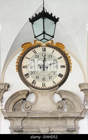 Renaissance wall watch and chandelier Stock Photo - Alamy