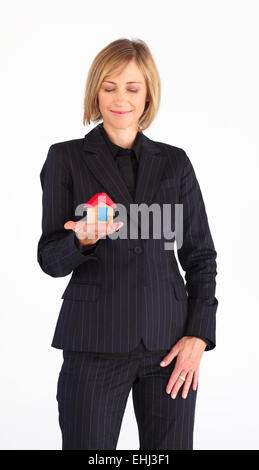 Female real estate agent with model of house on white background Stock ...