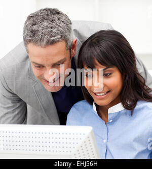 Mature manager checking his employee's work Stock Photo - Alamy