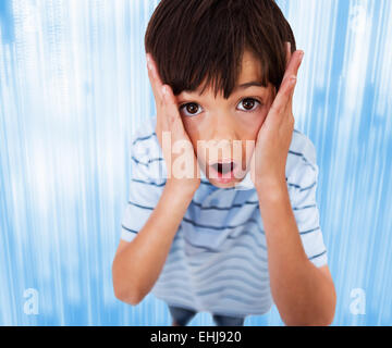 Boy standing looking scared Stock Photo - Alamy