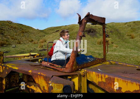 Woman driving old JCB digger on farmland on the Pennine Way Stock Photo ...