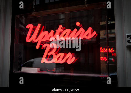 Upstairs bar sign Stock Photo - Alamy