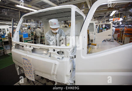 Kawasaki, Japan. 10th Mar, 2015. A staff worker of car manufacturer ...