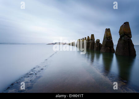 Cramond Island causeway with concrete pylons (dragon's teeth Stock ...