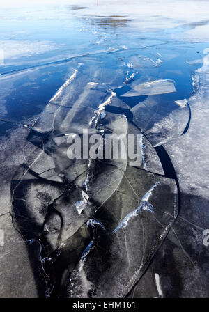 Cracking ice on lake Stock Photo - Alamy