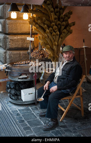 Man roasting chestnuts, Rome. Italy Stock Photo - Alamy