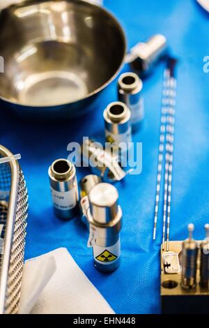 Prostate cancer radiotherapy surgery. Radiologist inserting a hollow ...