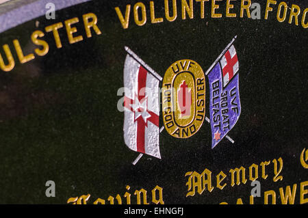 Gravestone of a Ulster Volunteer Force member with flags and the UVF ...