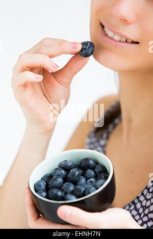 woman eating blueberries Stock Photo - Alamy