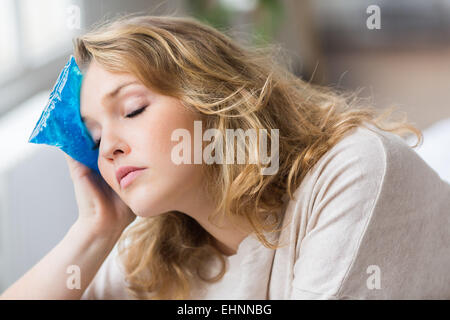 Woman Using Ice Gel Pack On Injured Arm Stock Photo - Alamy