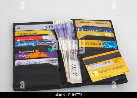 Black wallet with Assortment of credit cards Visa and American express ...