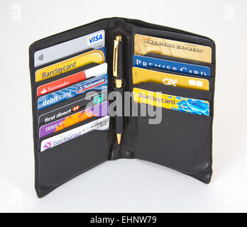 Black wallet with Assortment of credit cards Visa and American express ...