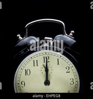 Alarm clock strikes midnight Stock Photo - Alamy