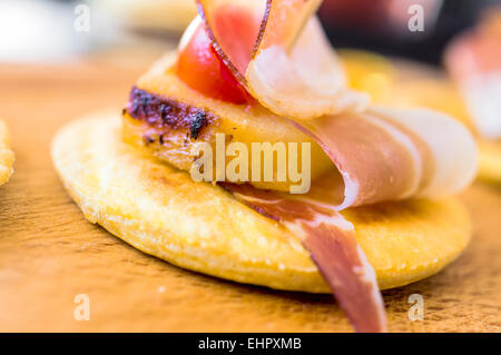 Tapas with bacon and potatoes, olives and tomatoes Stock Photo - Alamy