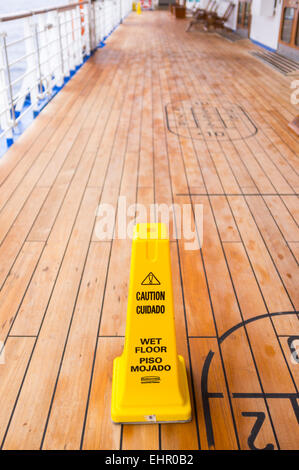 Caution warning sign slippery deck dangerous wet Stock Photo - Alamy