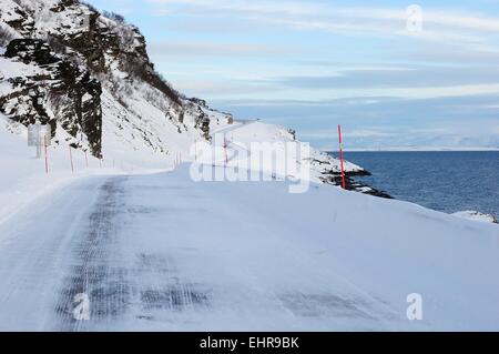 The snow-covered main road E69 on Porsangerfjord, Finnmark County ...