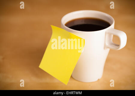 Empty post-it note sticked on piggy bank Stock Photo - Alamy