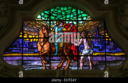 Painting depicting Saint Martin of Tours cuting a piece of his cloak in ...