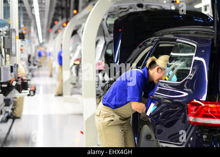 Production of VW cars in a factory, worker installing car door Stock ...