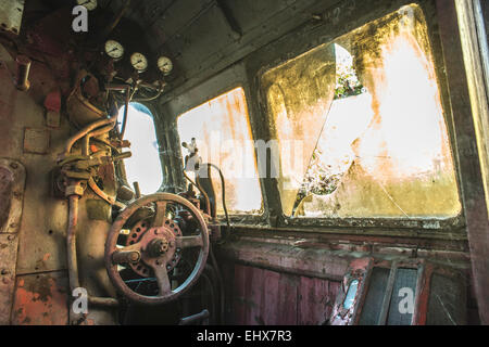 Old broken down steam train engine and tender being restored in a Stock ...
