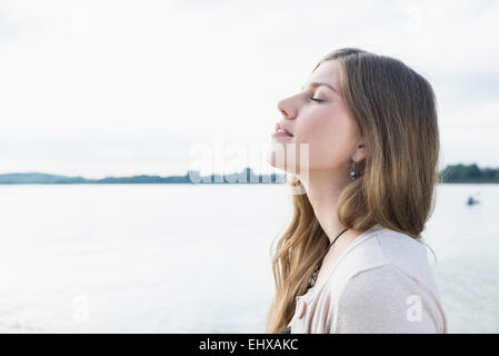 Profile side photo of young pretty woman use cellphone comment app ...