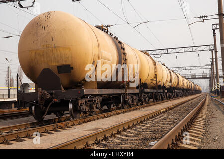 Freight train with petroleum tank cars on railroad. Rail cars carry oil ...