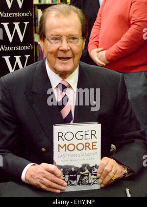 Sir Roger Moore signs copies of his new book 'Last Man Standing Stock ...