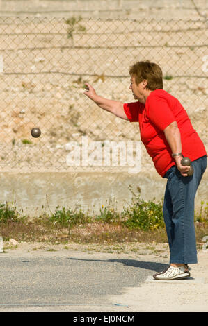 Woman playing pÈtanque Stock Photo - Alamy