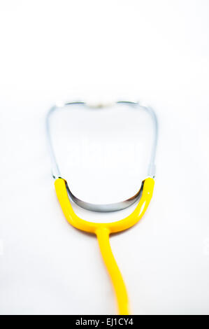 Yellow medical stethoscope isolated Stock Photo - Alamy