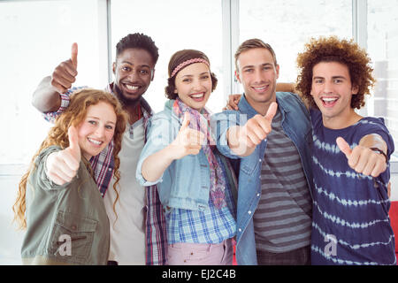 Fashion students smiling at camera together Stock Photo - Alamy