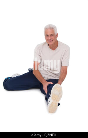 Determined elderly man stretching body, have outdoor workout Stock ...