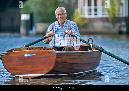 Old man in a rowboat (boat) on sea. Illustrated Photo - No cognizable ...