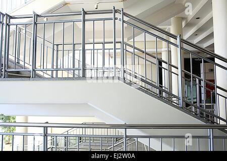Stairs in a concrete office building in neutral tones, covered with ...