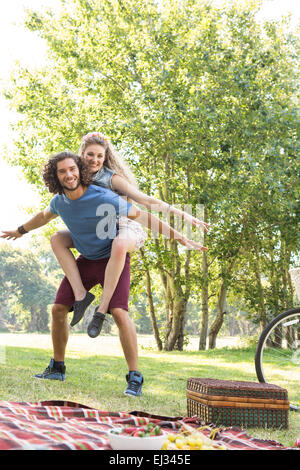 Cute young couple having picnic on romantic date outdoors Stock Photo ...