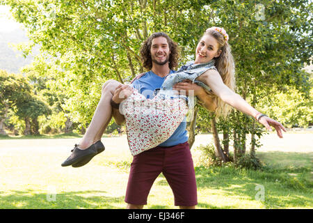 Cute couple having fun in park Stock Photo - Alamy