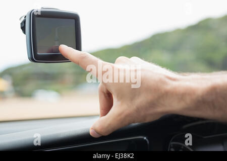 Man using satellite navigation system Stock Photo - Alamy