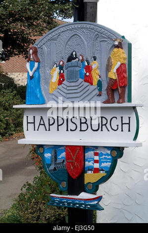 The Happisburgh village sign, depicting figures and landmarks from the ...
