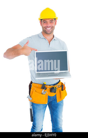 Workman pointing to computer screen Stock Photo - Alamy