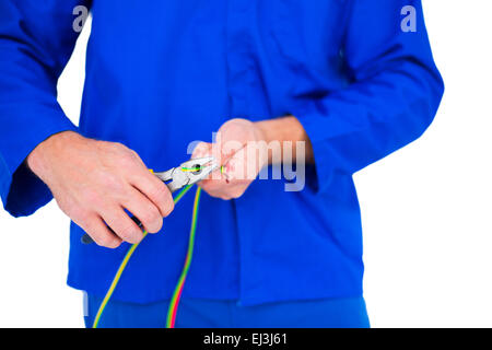 Electrician cutting wire with pliers Stock Photo - Alamy