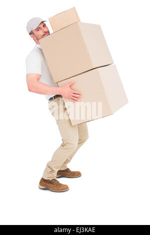 Tired young man carrying stack of boxes. Exhausted male carrier with ...