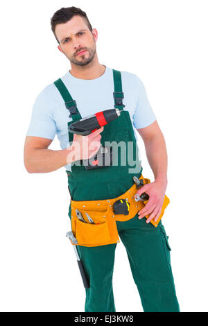 Construction worker holding power drill Stock Photo - Alamy