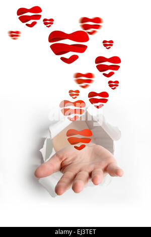 Composite image of hand bursting through paper Stock Photo - Alamy