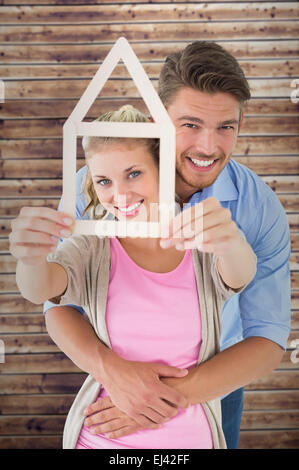 Young couple holding house model and key, closeup Stock Photo - Alamy