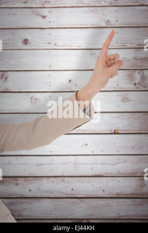 Composite image of businesswoman pointing up Stock Photo - Alamy