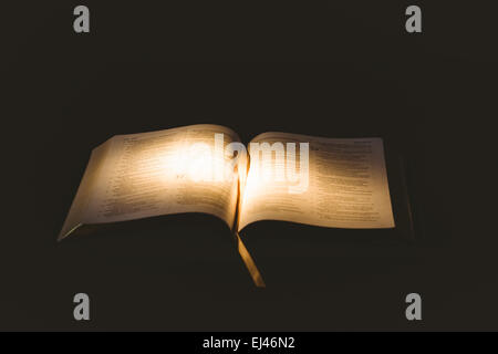 Light shining on Holy Bible in old English Cathedral Stock Photo - Alamy