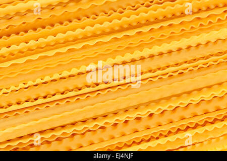 Italian dry wavy pasta background. Healthy traditional food. Top view ...