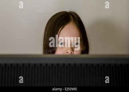 Girl Staring At Her Computer Monitor Stock Photo - Alamy