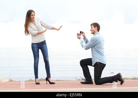 Refusal of love. Rejecting marriage proposal. woman holding in hand ...